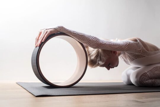 5 Easy Yoga Wheel Positions for Beginners